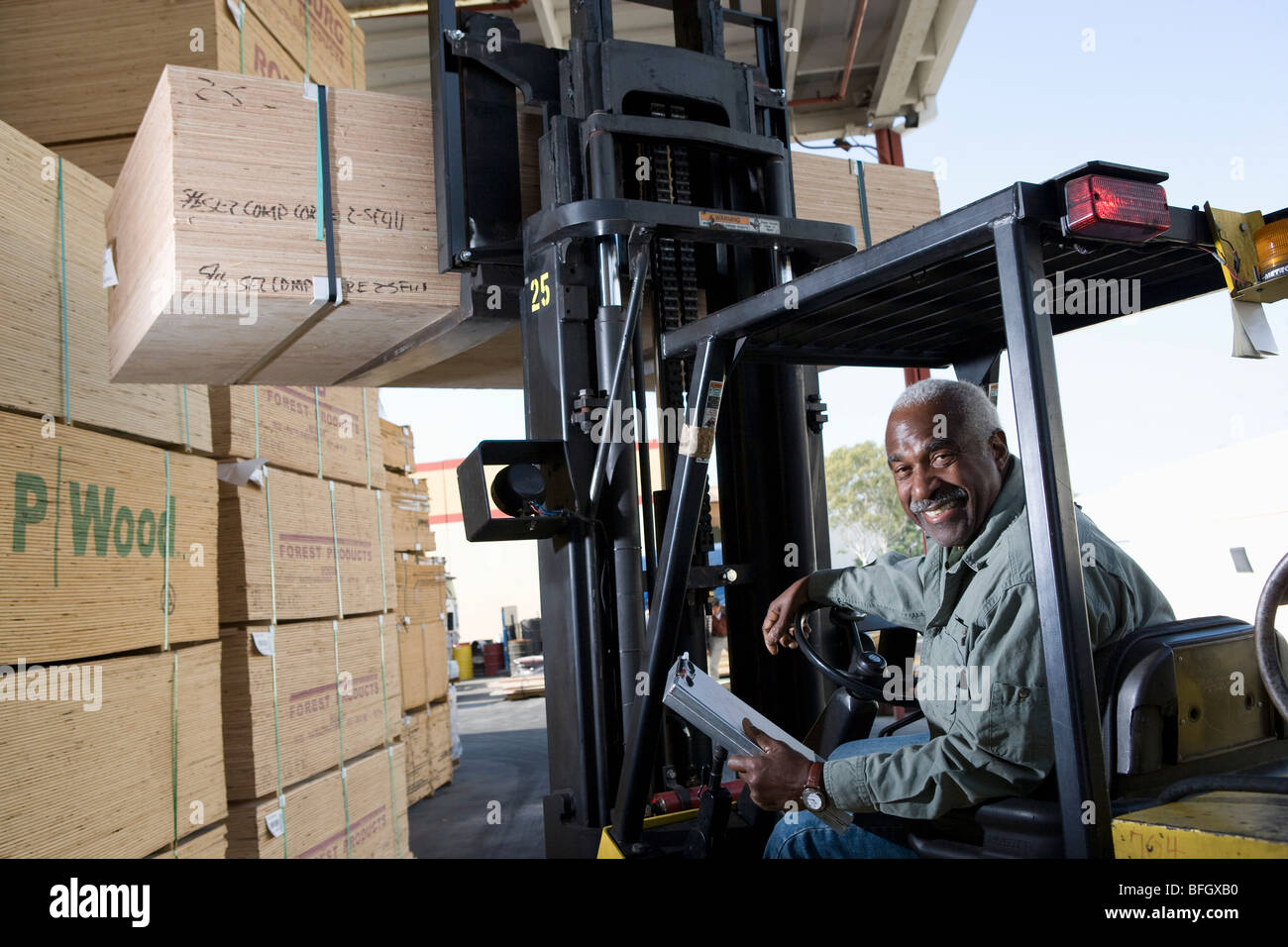 Man sitting with forklift truck hi-res stock photography and images - Alamy