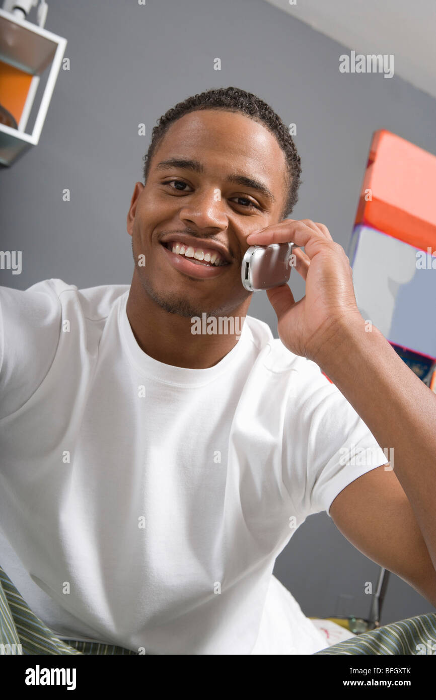 Young Man Using Cell Phone Stock Photo - Alamy