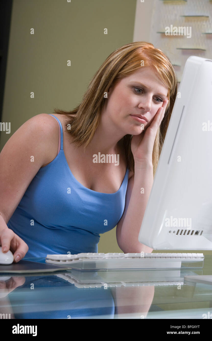 Woman Using a Computer Stock Photo - Alamy