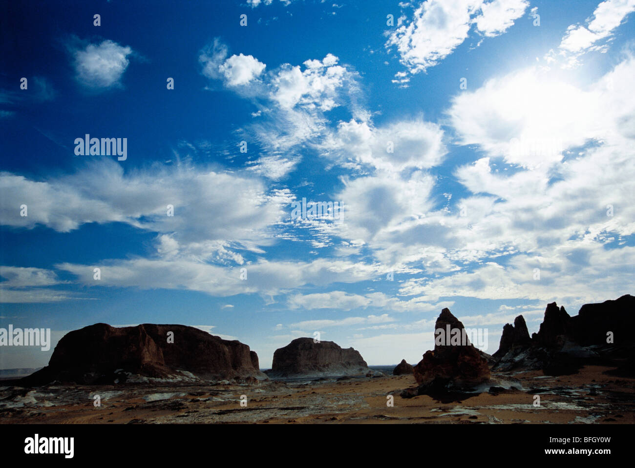Bright Clouds over Rugged Landscape Stock Photo - Alamy