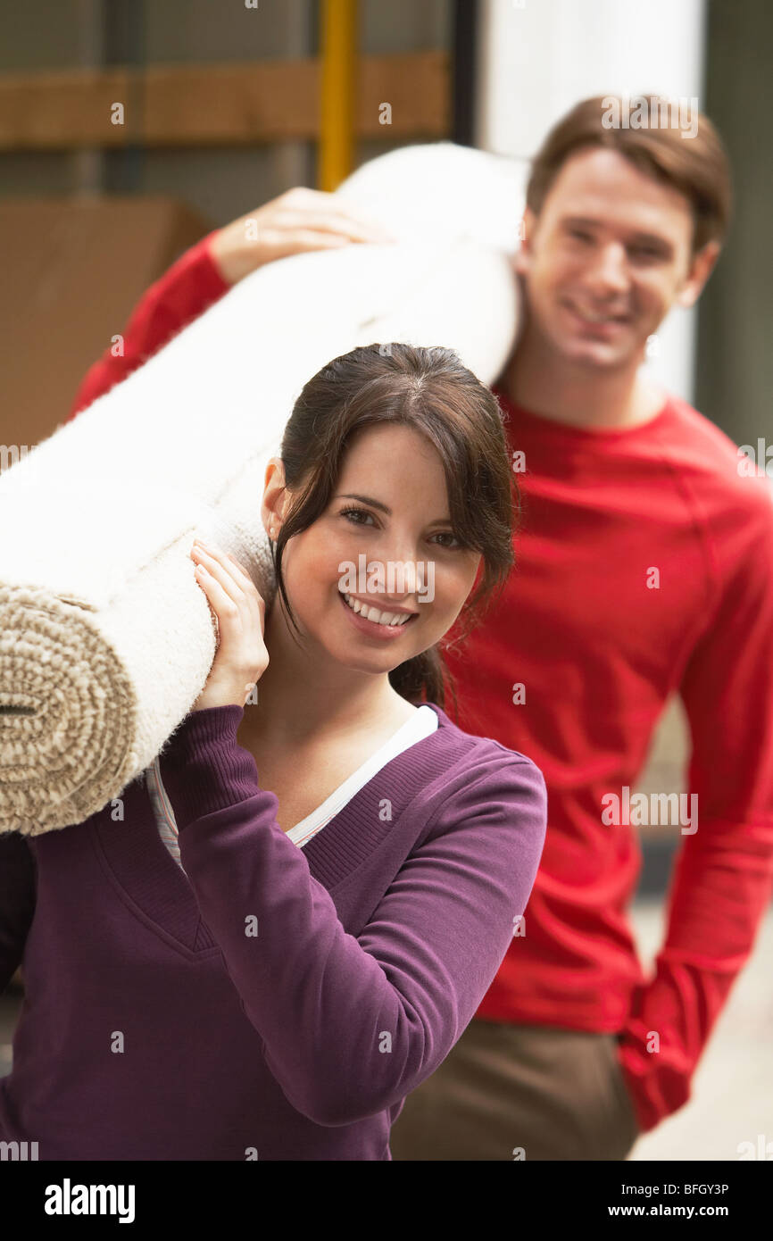 Two men carrying carpet hi-res stock photography and images - Alamy