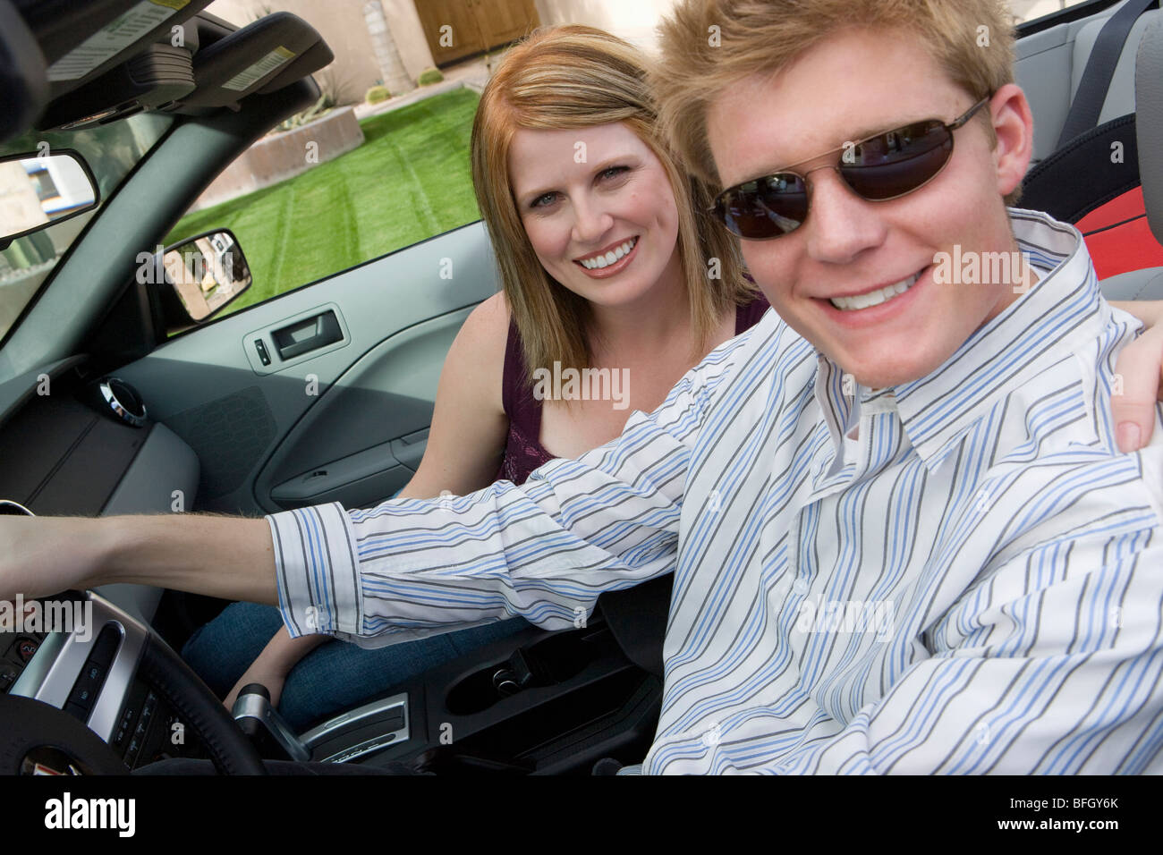 Couple Driving Car Stock Photo - Alamy