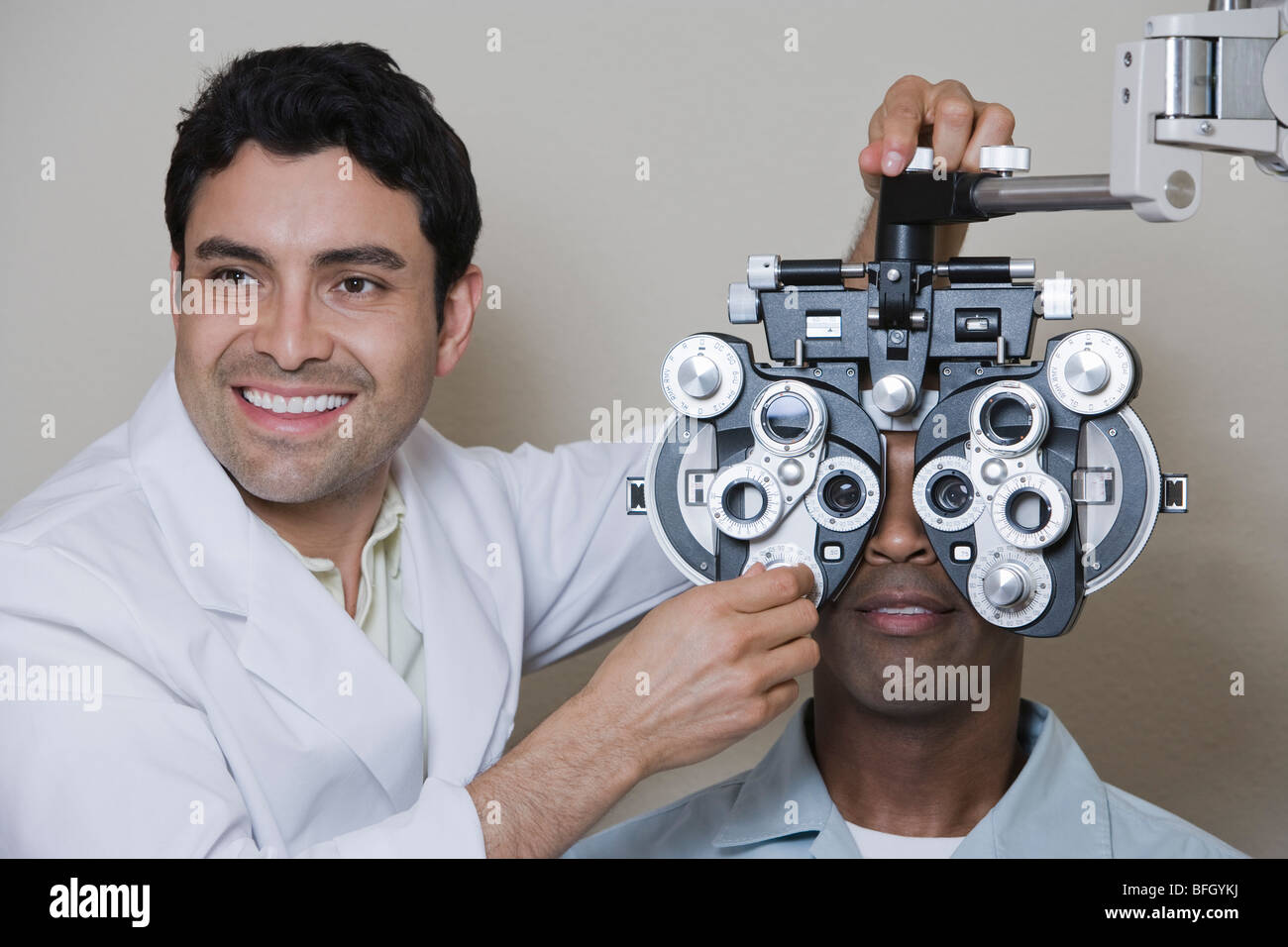 Optometrist examining patient's eyes Stock Photo - Alamy