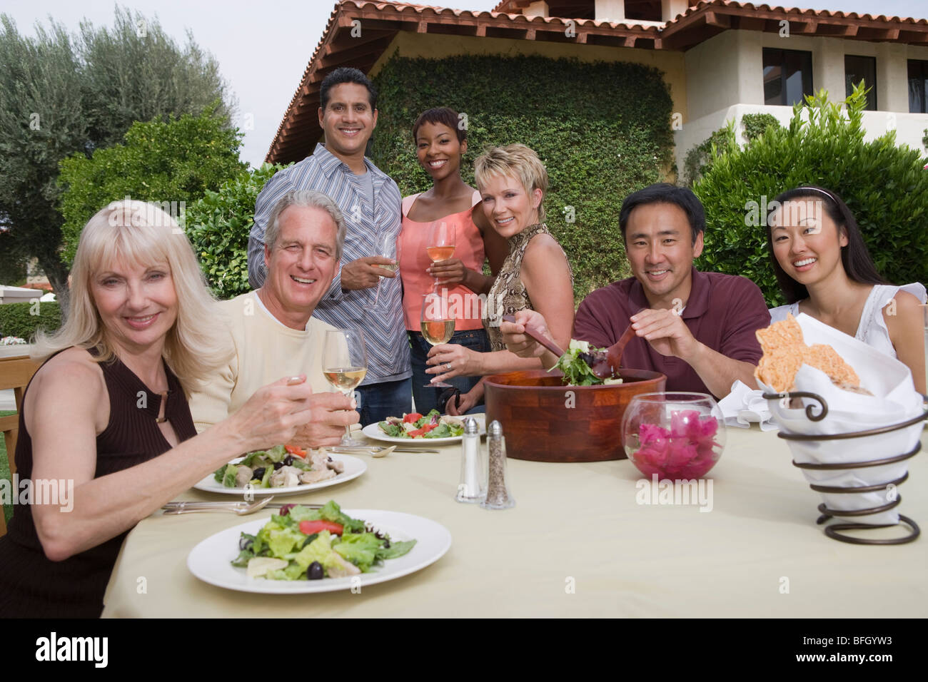 Group of friends dining outdoors, portrait Stock Photo - Alamy