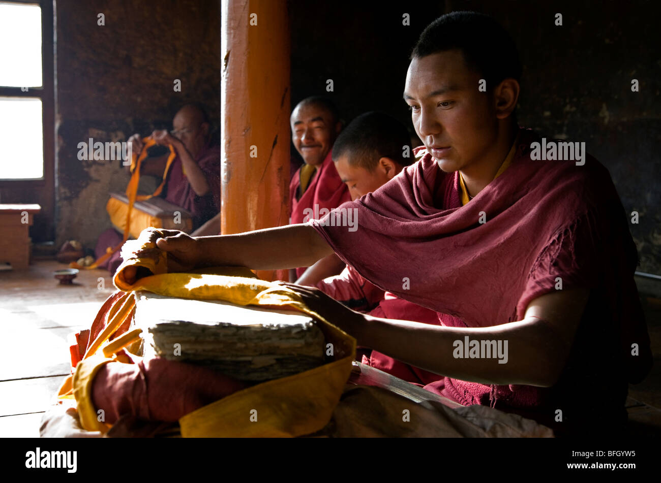 Buddhist monk covering the sacred texts. Lingshed monastery. Zanskar ...