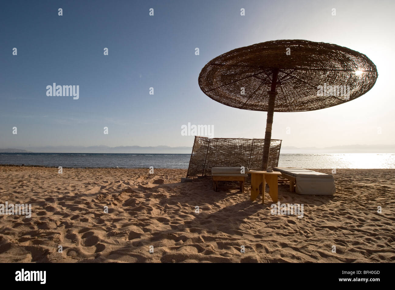 Taba Beach in Egypt's Red sea resort, with an parasol and sun chairs ...