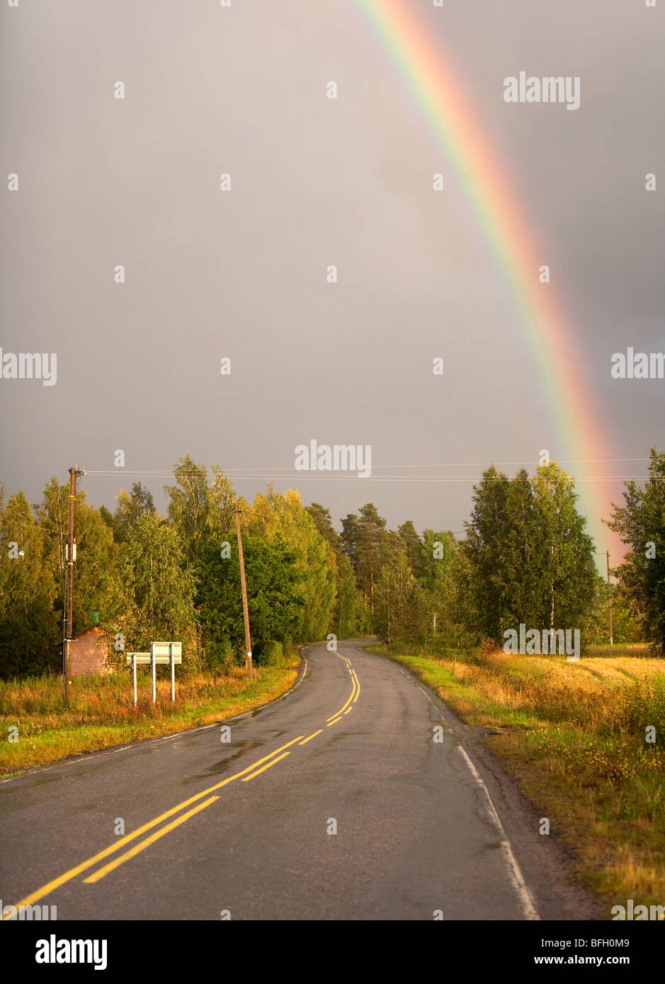 Rainbow and road , Finland Stock Photo - Alamy