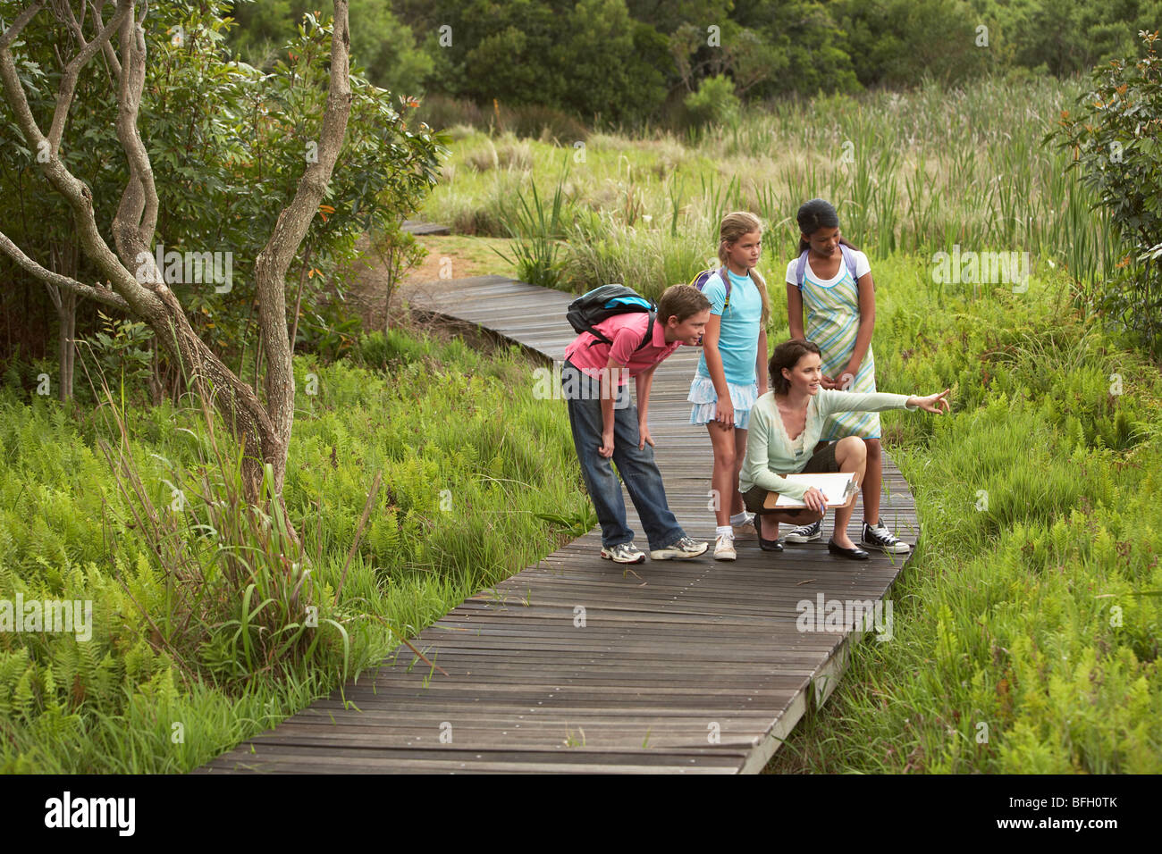 Woman and Children Spectating Plants Stock Photo - Alamy