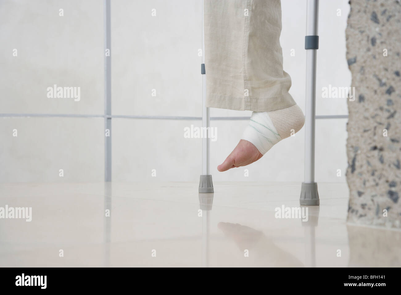 Person on crutches hi-res stock photography and images - Alamy