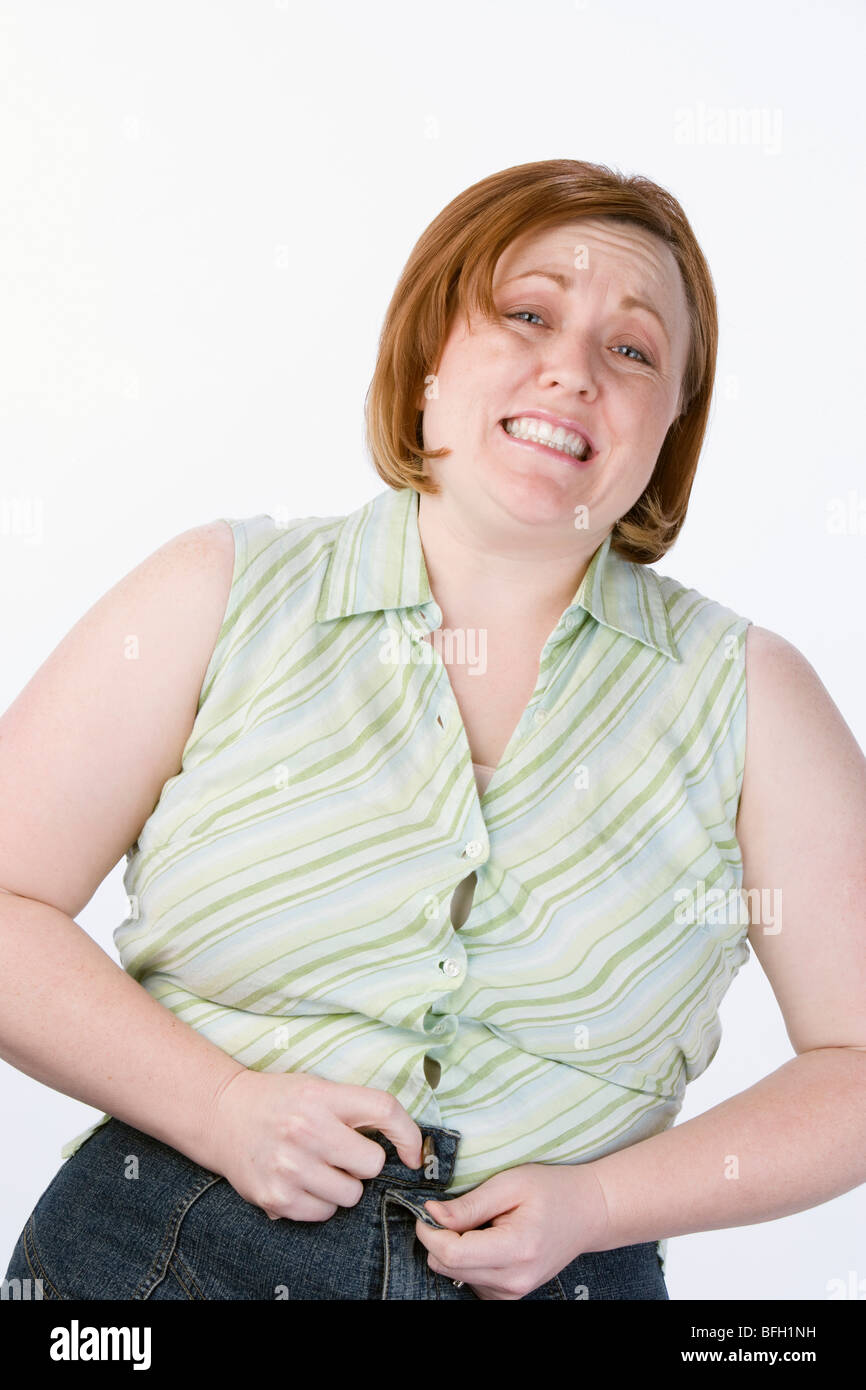 Studio portrait of overweight woman Stock Photo - Alamy