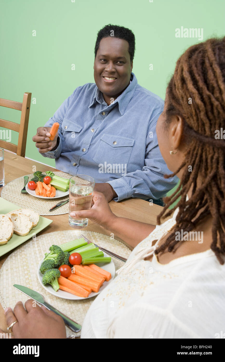 Overweight mid-adult couple having healthy meal Stock Photo - Alamy