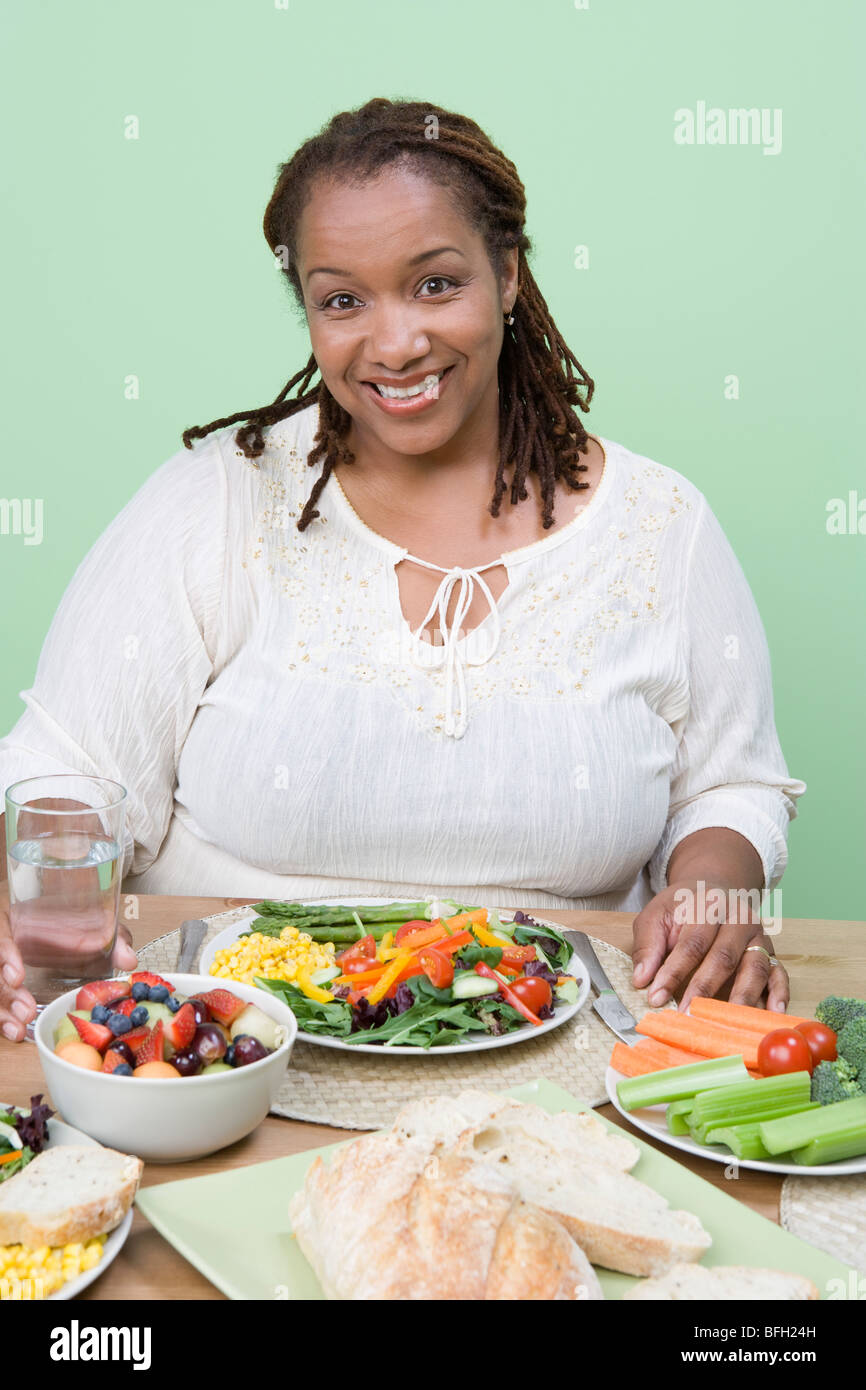 Overweight mid-adult woman having healthy meal Stock Photo - Alamy