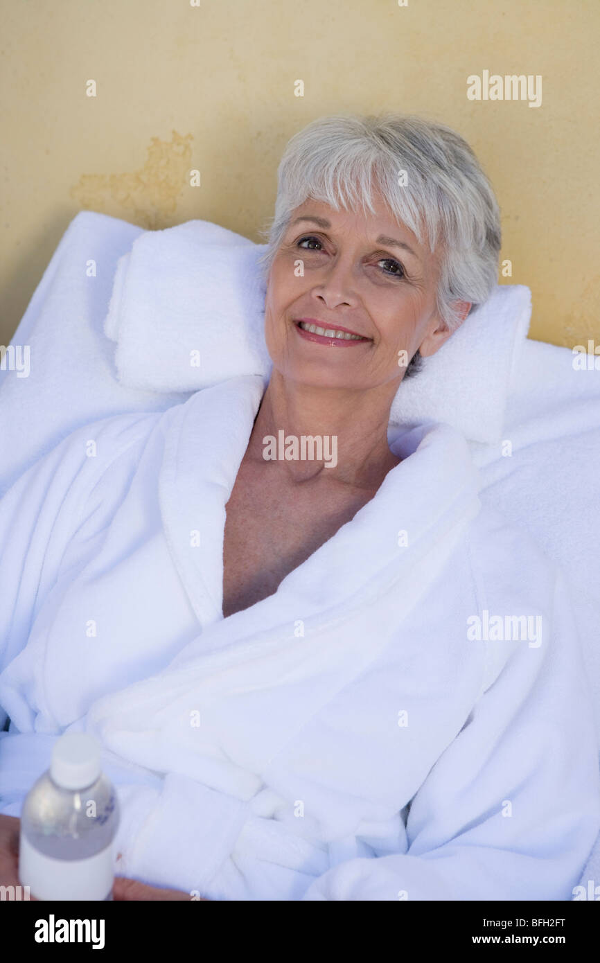 Portrait of senior woman in bathrobe at health spa Stock Photo - Alamy