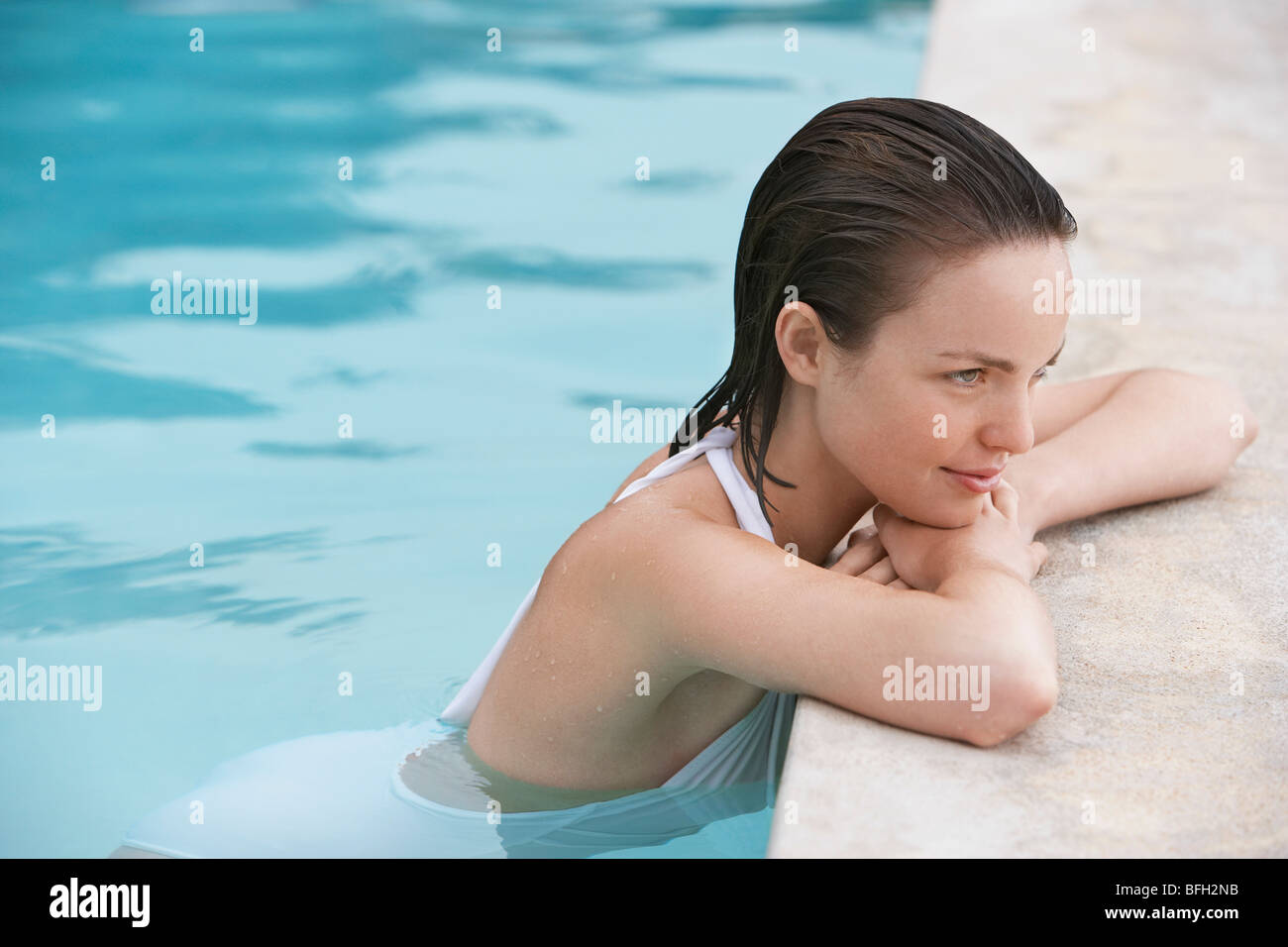Women resting in swimming pool Stock Photo - Alamy