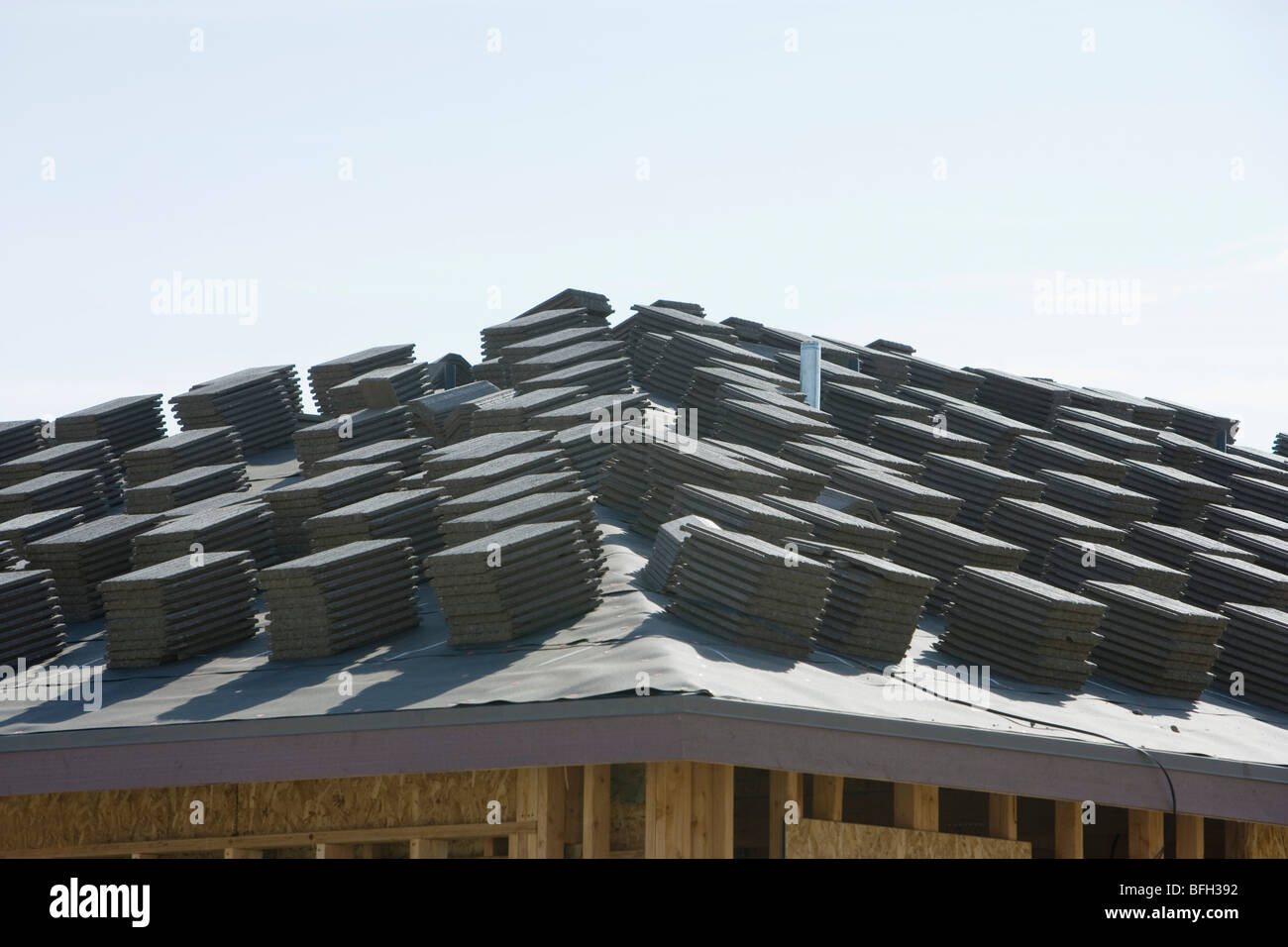 Stacks of tiles on building roof Stock Photo - Alamy