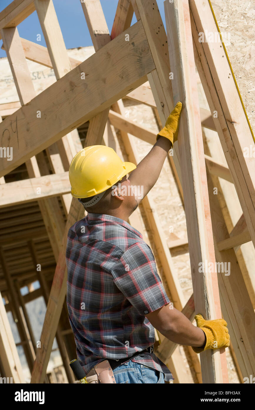 Construction worker at work on building Stock Photo - Alamy