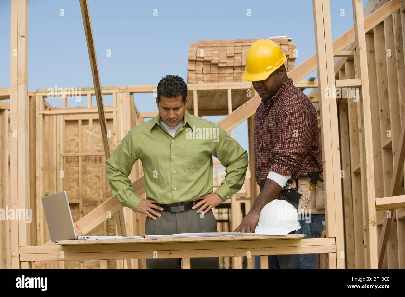 Surveyors working on construction site Stock Photo - Alamy