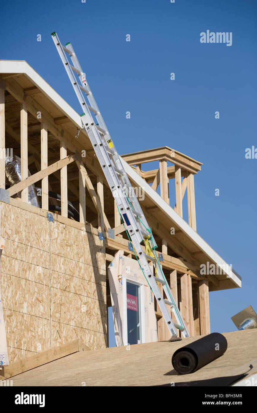 Ladder on wooden house construction Stock Photo - Alamy