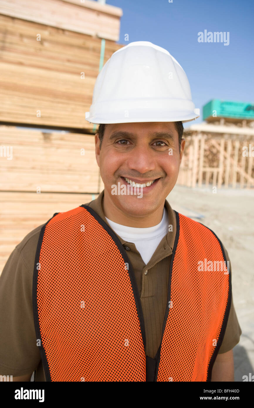 Construction worker standing on construction site Stock Photo - Alamy