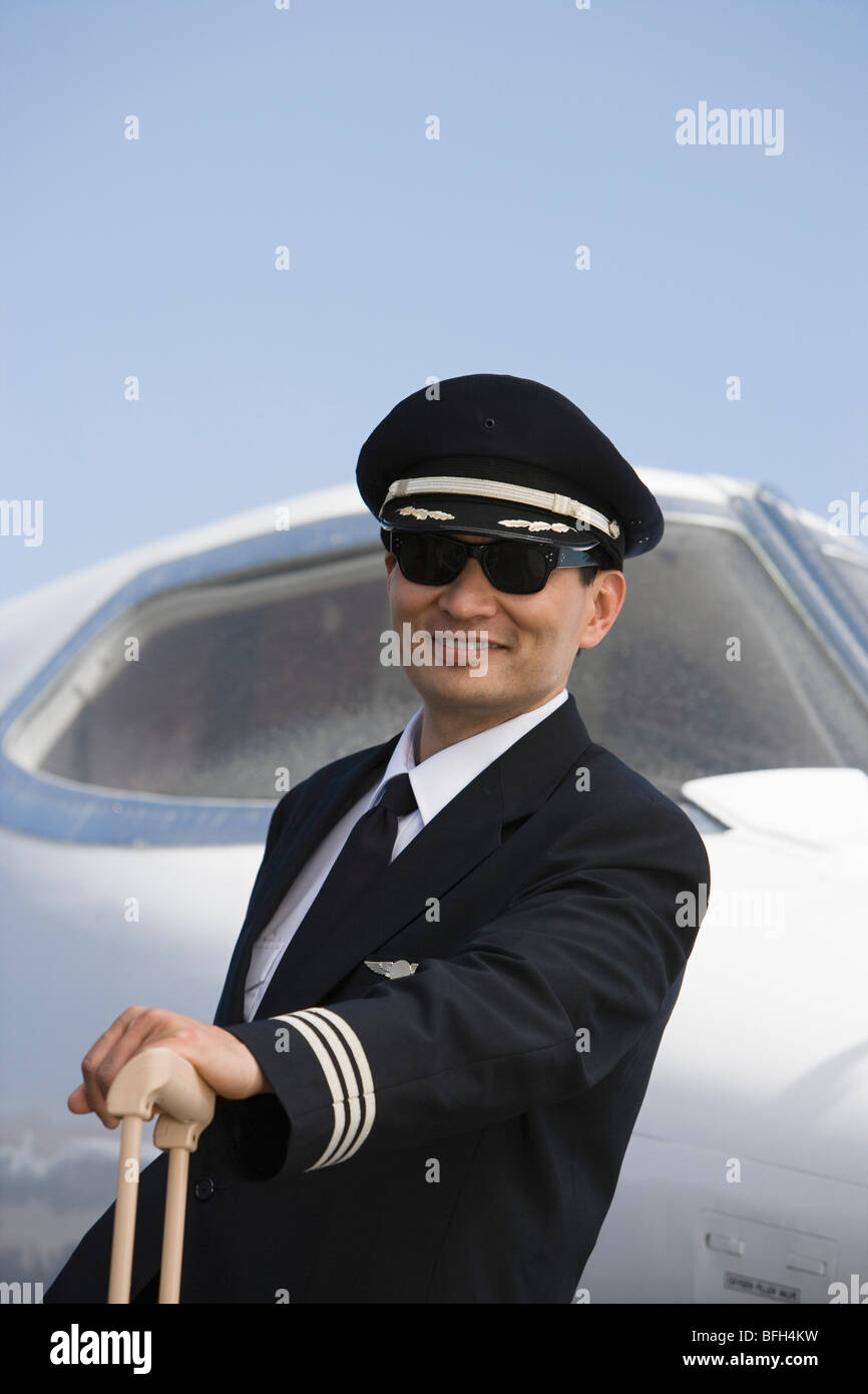 Portrait of Asian mid-adult pilot Stock Photo - Alamy