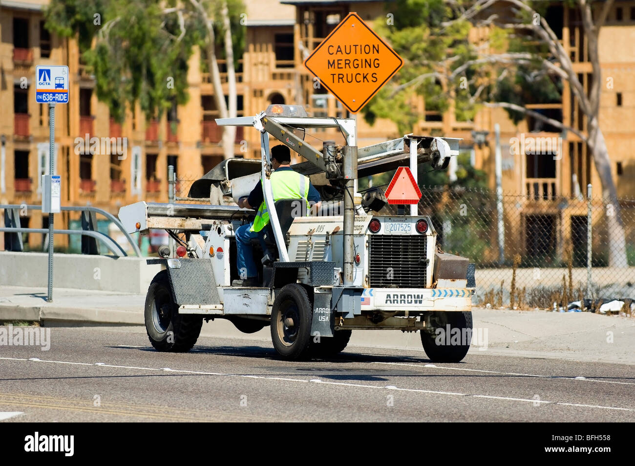 Construction equipment driving with residential structure being built ...