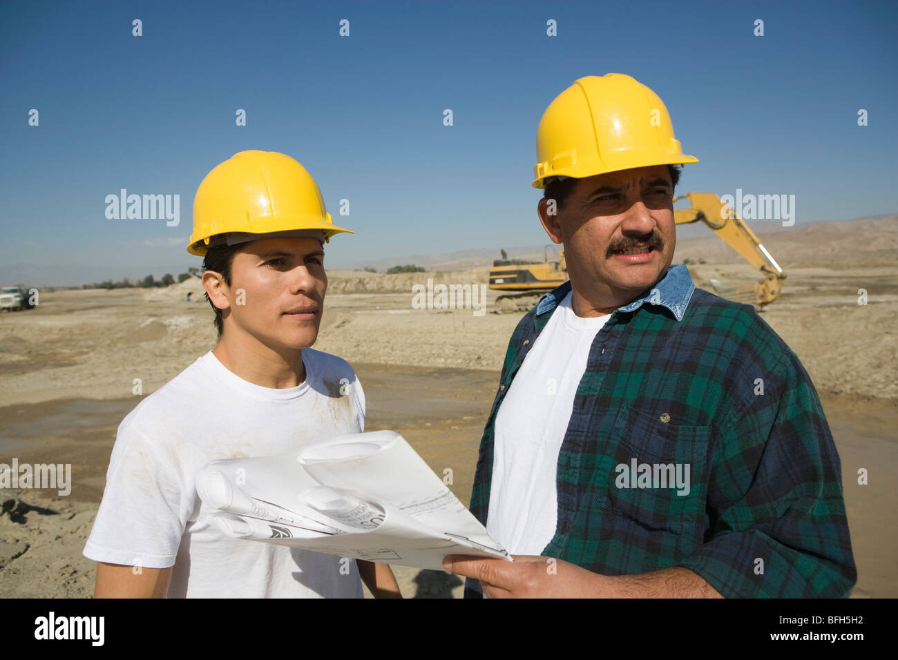 Construction Workers on construction site Stock Photo - Alamy