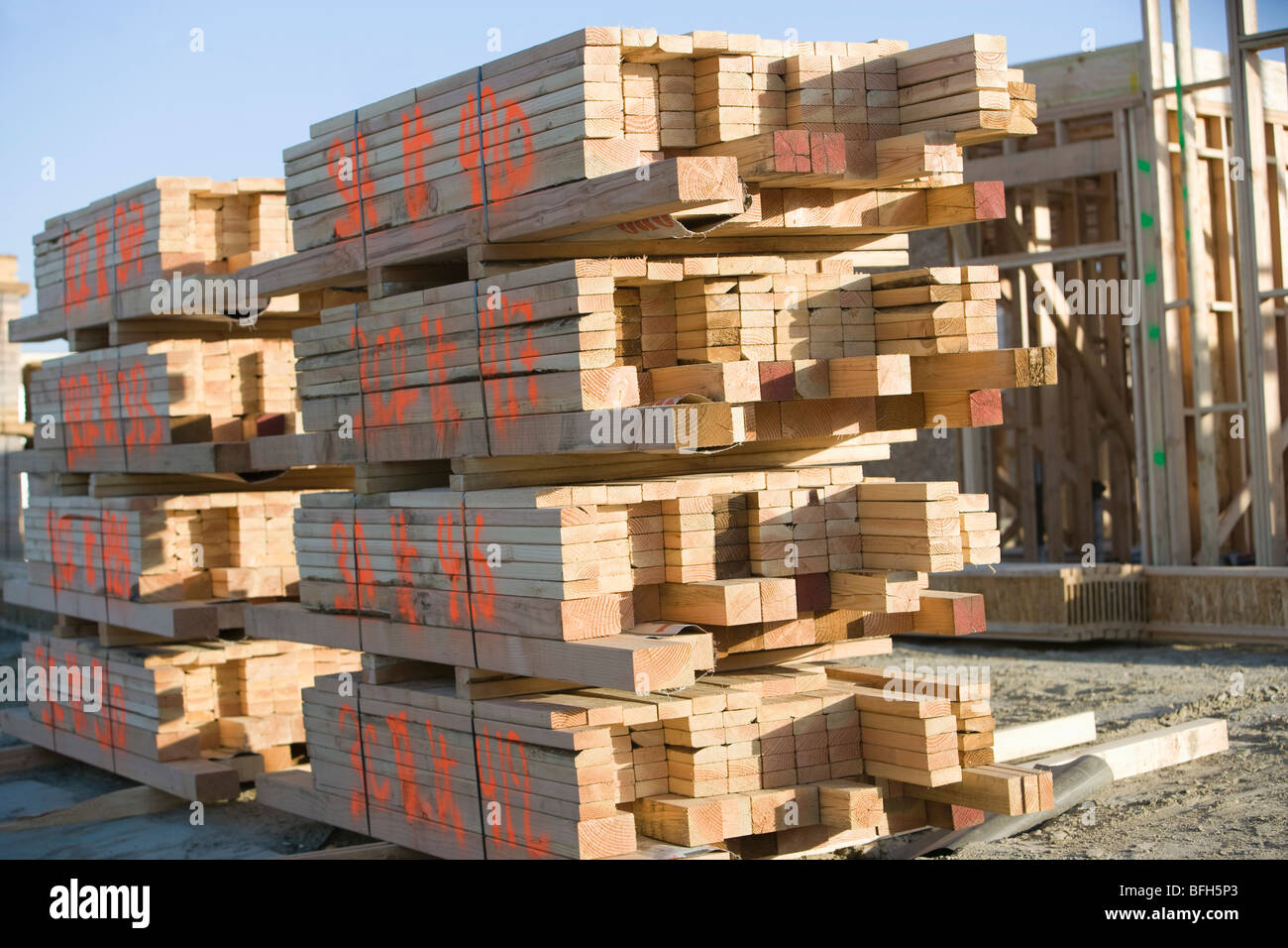 Building construction and Stacks of Planks Stock Photo - Alamy