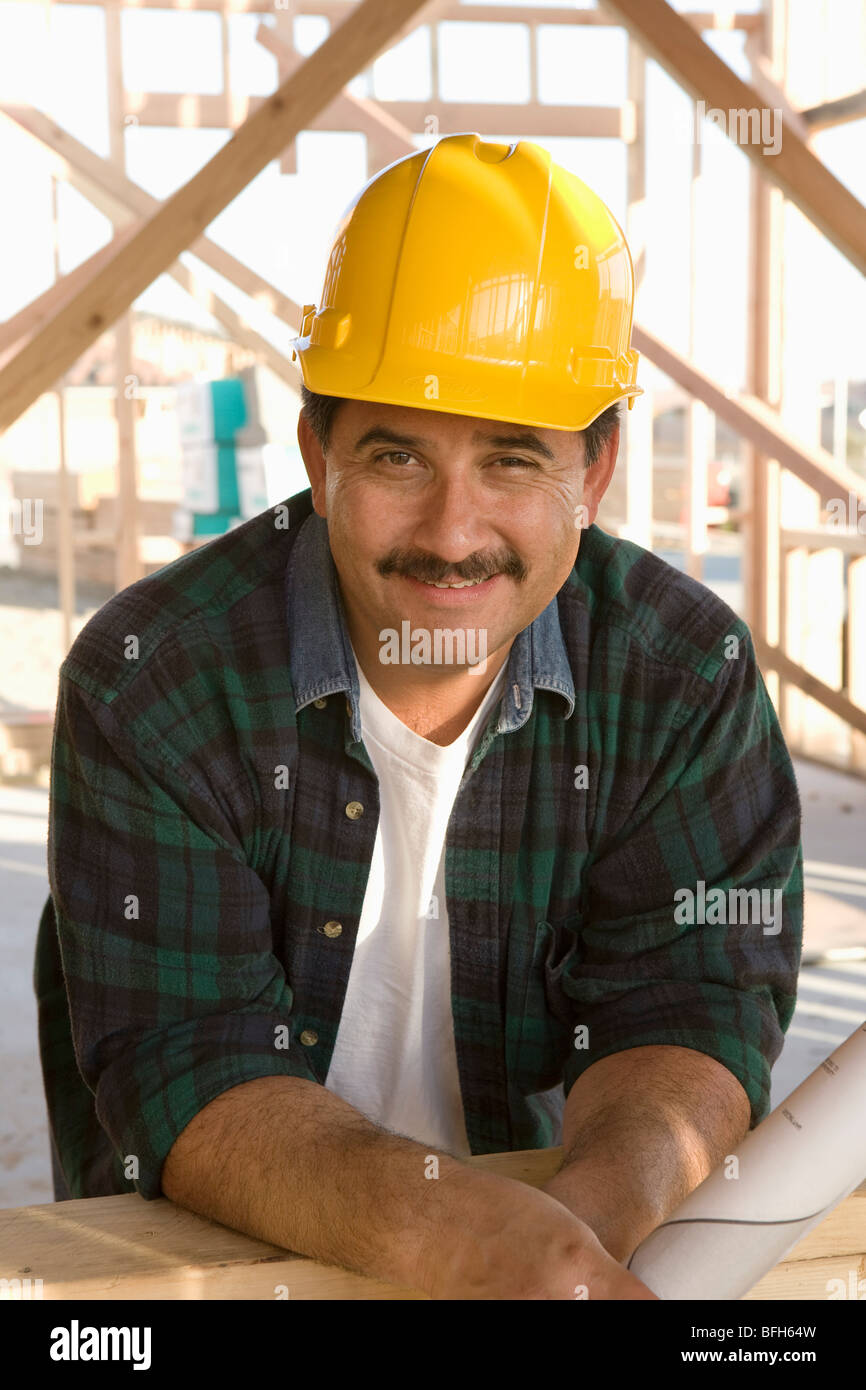 Portrait of man at construction site in hardhat Stock Photo - Alamy