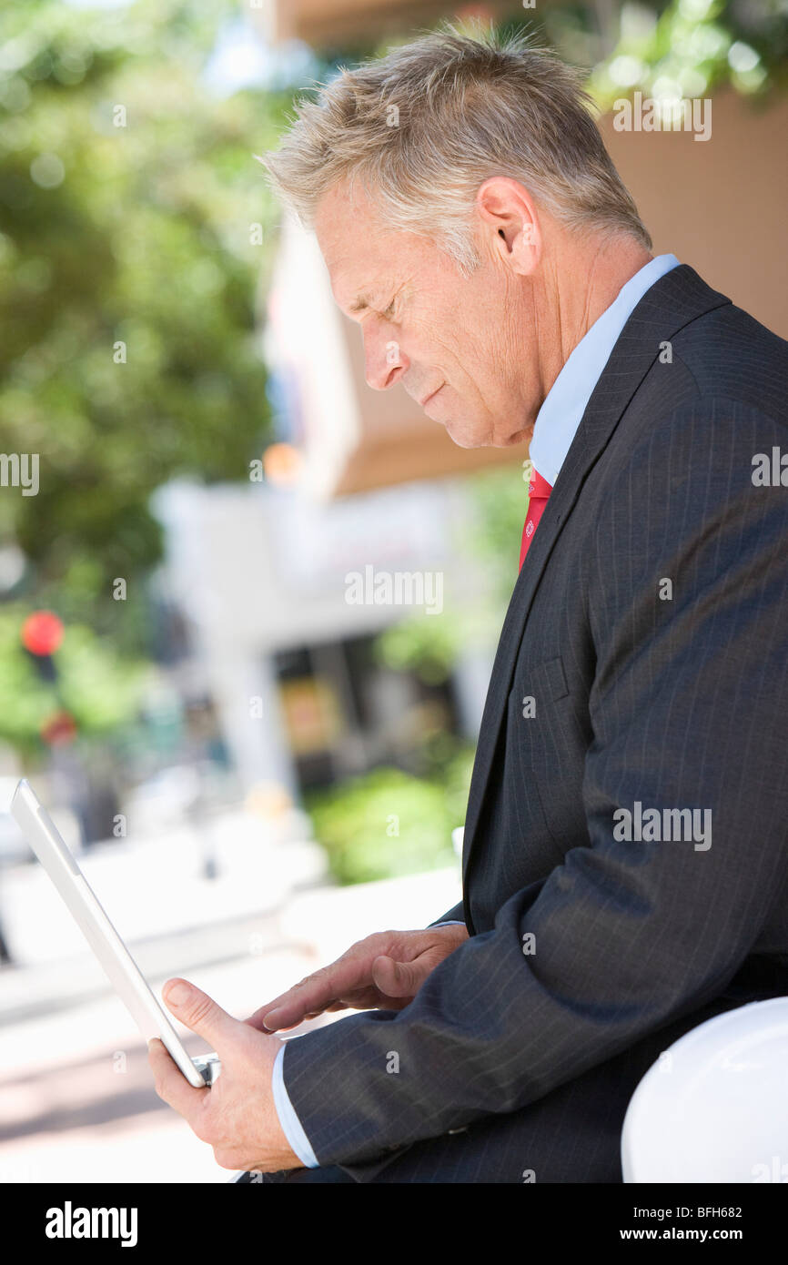 Middle aged businessman laptop using hi-res stock photography and ...
