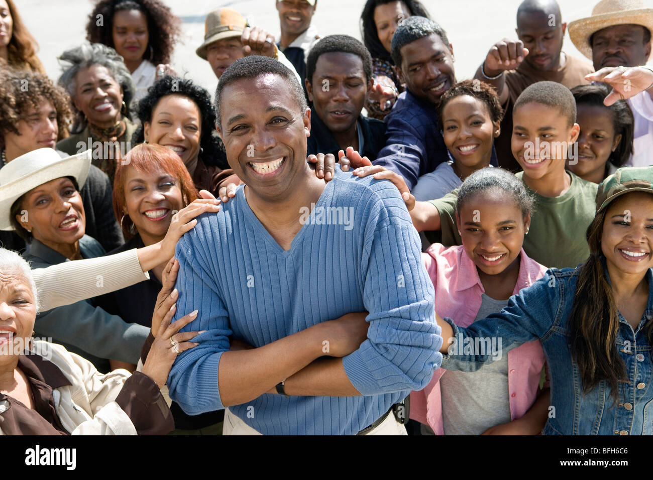 Man surrounded by crowd Stock Photo - Alamy