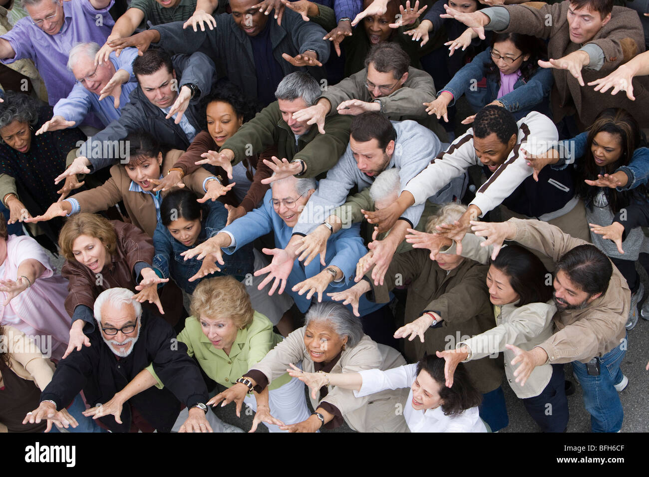 Crowd with arms raised Stock Photo - Alamy