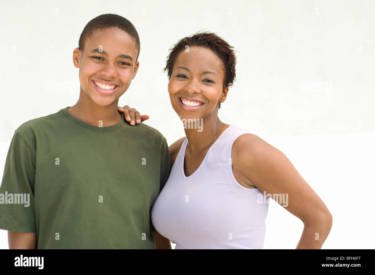Studio portrait of mother and son smiling Stock Photo - Alamy
