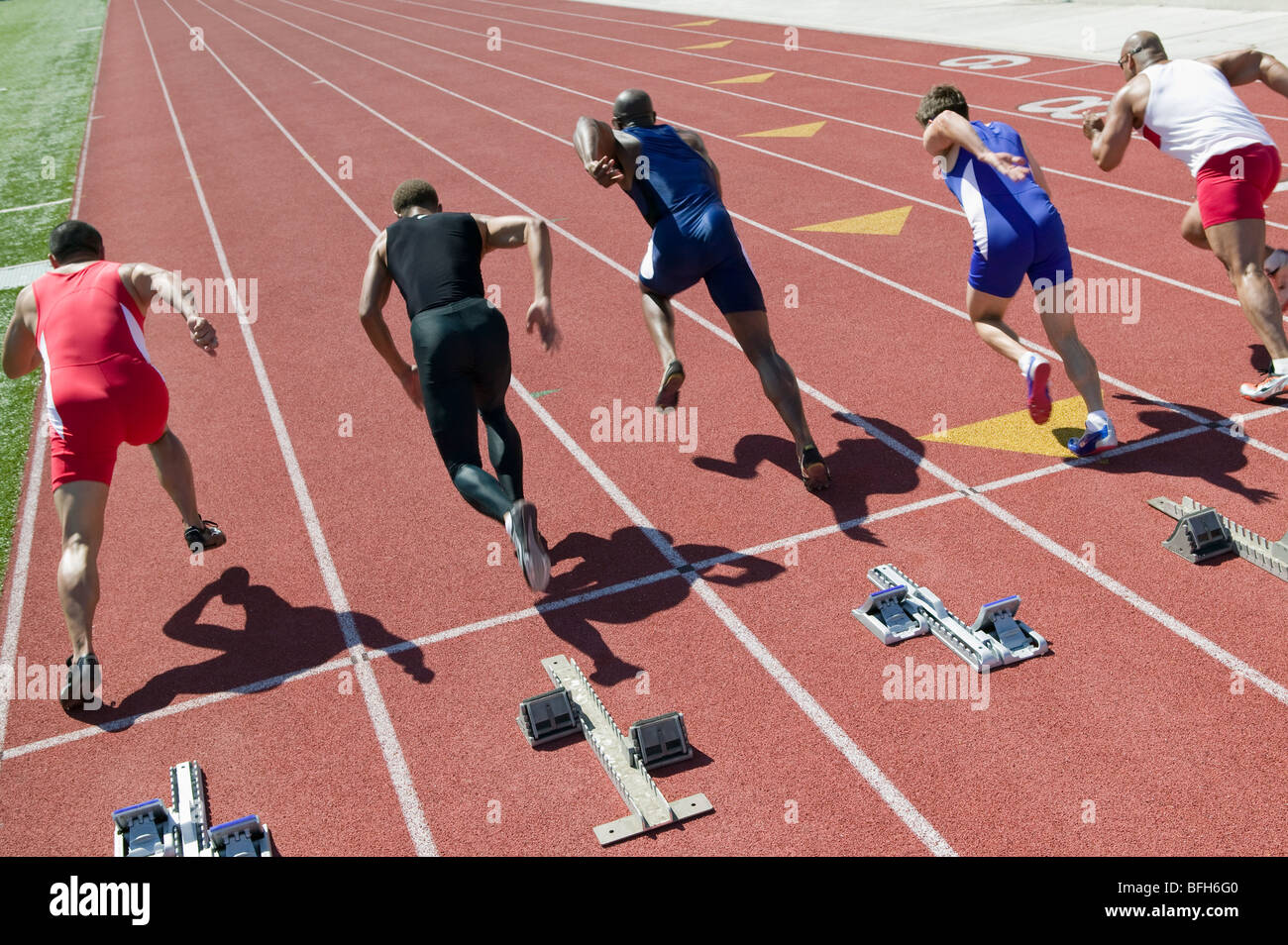 Male sprinters leaving starting block hi-res stock photography and ...
