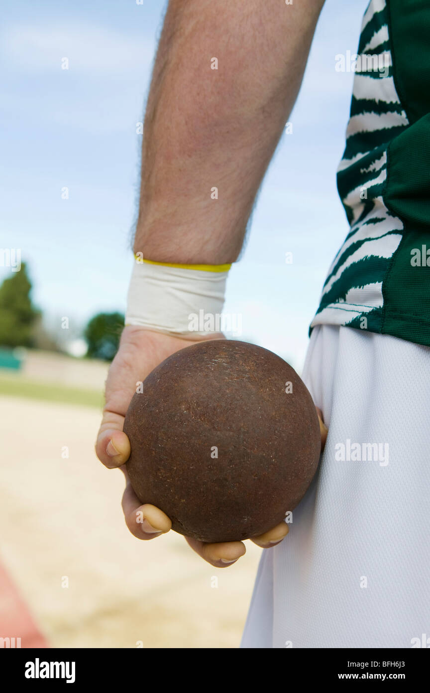 Male shot putter holding shot, close-up view Stock Photo - Alamy