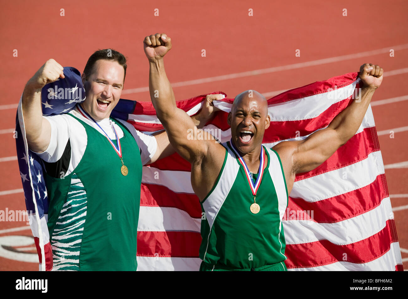 Two male athletes enjoying victory, portrait Stock Photo - Alamy