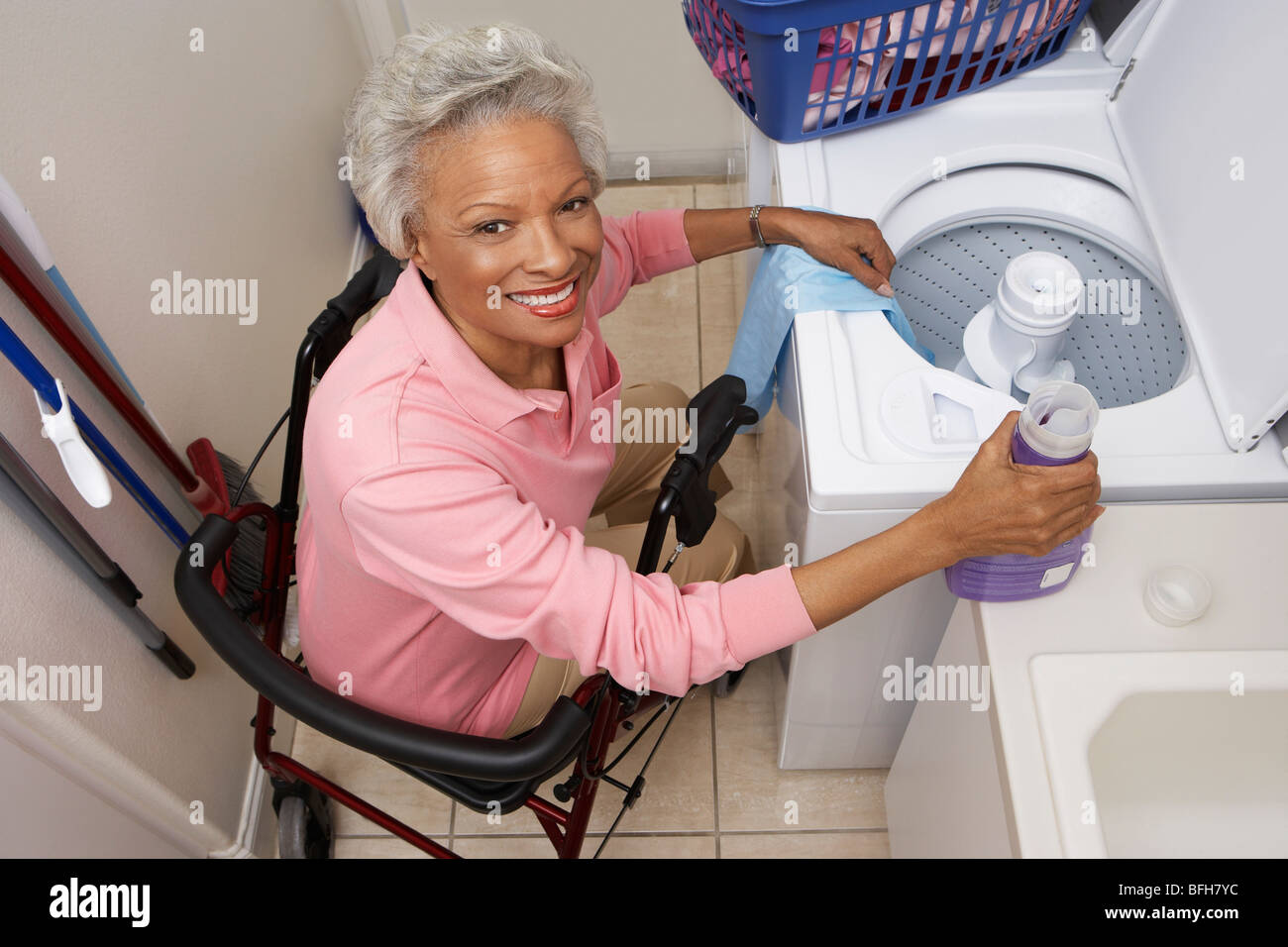 Woman doing laundry at home Stock Photo - Alamy