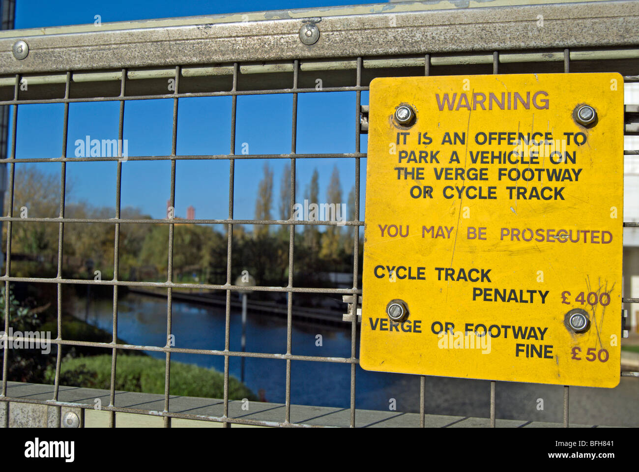 british traffic warning sign with penalties for parking on verge ...