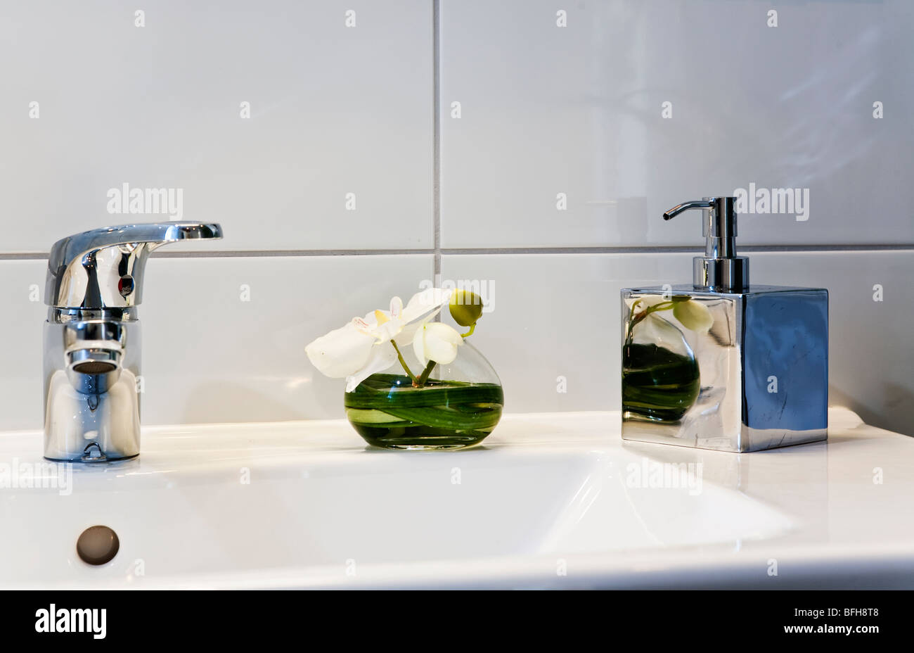 Wash basin with a flower Stock Photo - Alamy