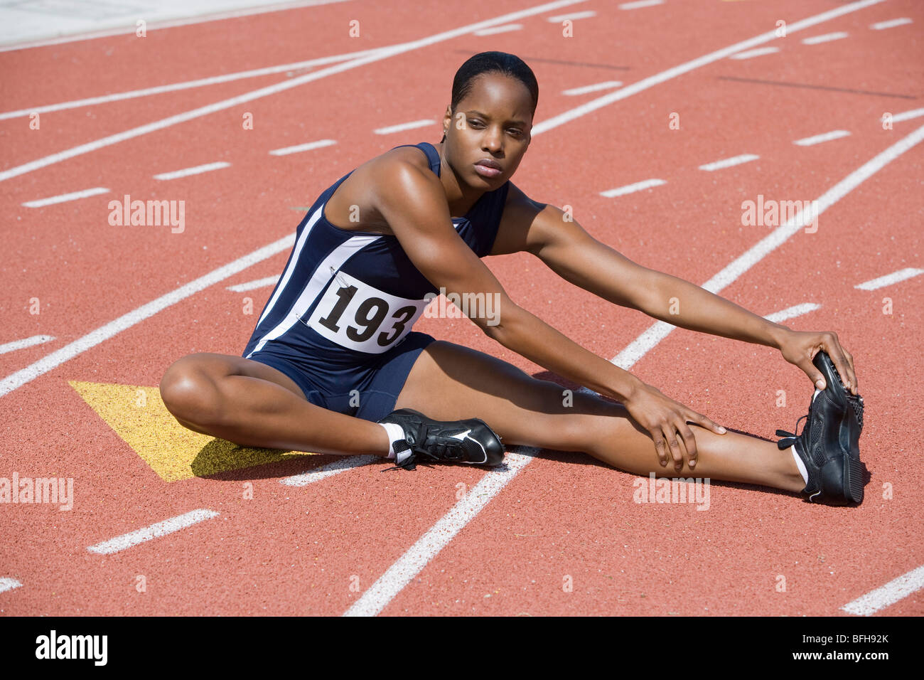 Female athlete stretching Stock Photo - Alamy