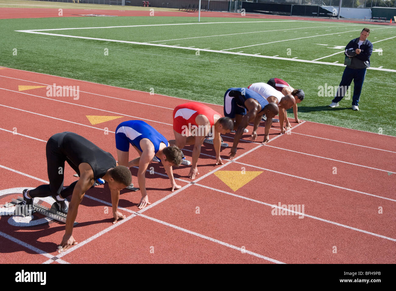 Athletes ready to run, high angle view Stock Photo - Alamy