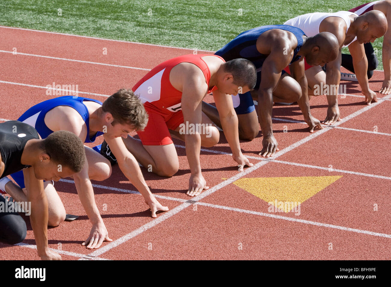 Athletes ready to run, high angle view Stock Photo - Alamy