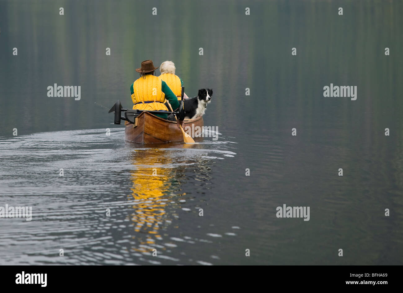 Paddlers in a canoe on Muchalat Lake near Gold River, Vancouver Island ...