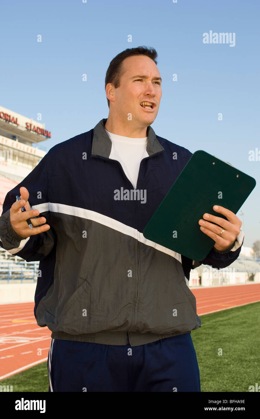 Sports coach giving instructions Stock Photo - Alamy