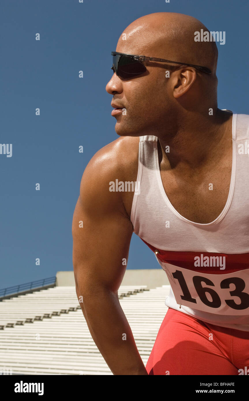 Runner with sunglasses on a track Stock Photo - Alamy
