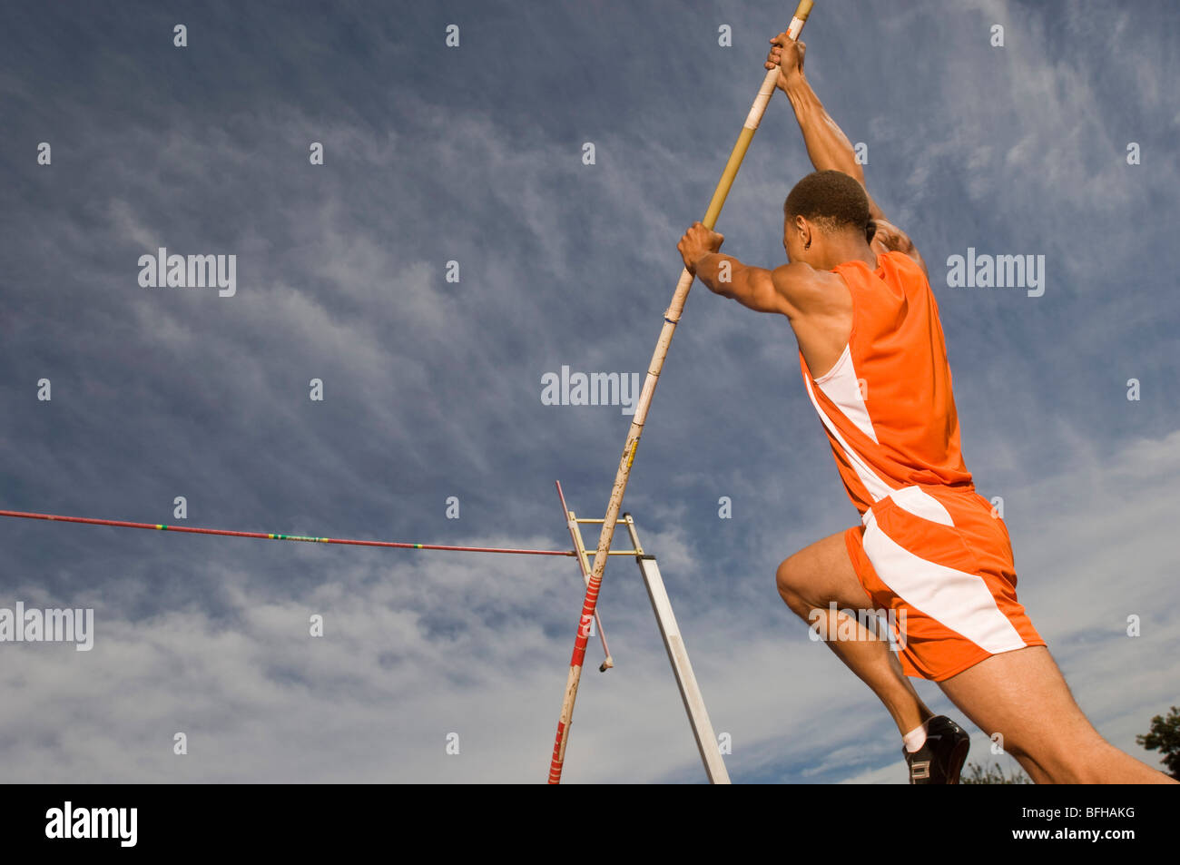 Pole vaulted taking off Stock Photo - Alamy