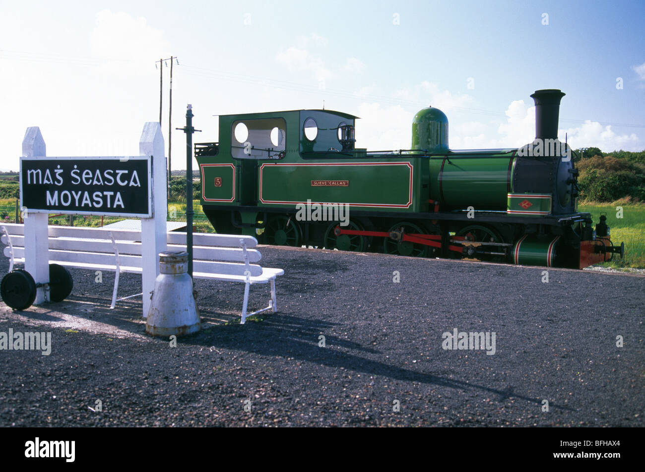 old rural steam engine standing at one of its former stations on the ...