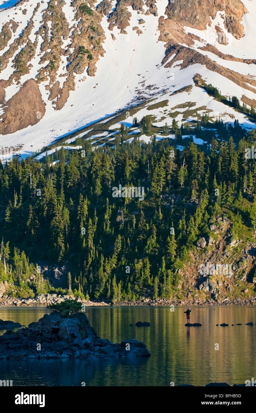 Fly fisherman below Mount Price at Garibaldi Lake in Garibaldi ...