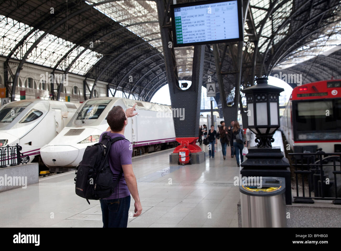 young man at the train station Stock Photo - Alamy