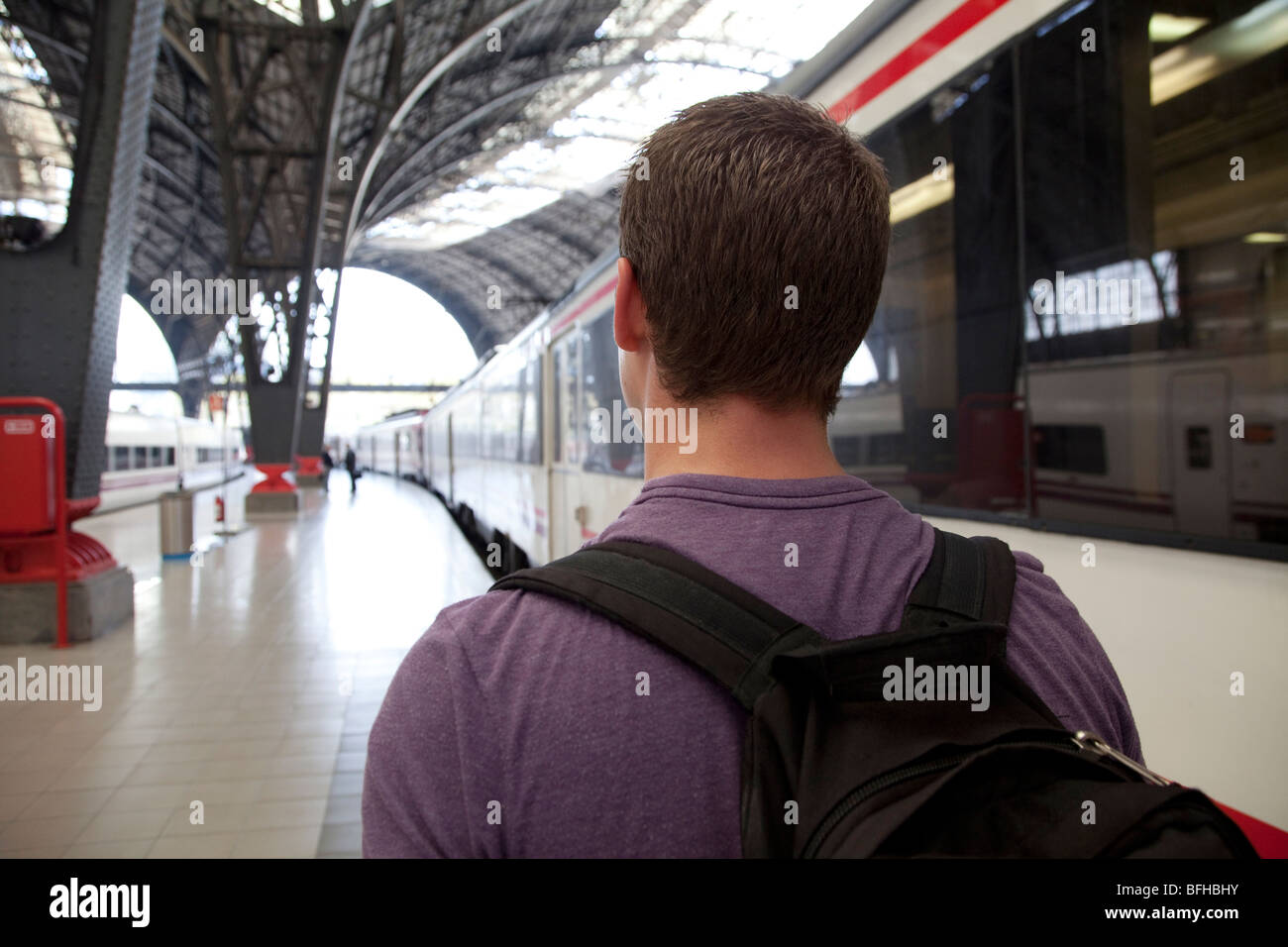 young man at the train station Stock Photo - Alamy