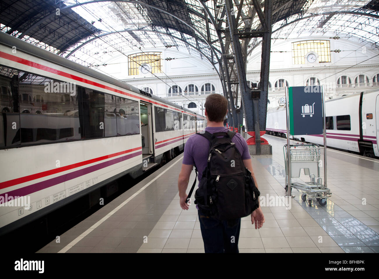 young man at the train station Stock Photo - Alamy